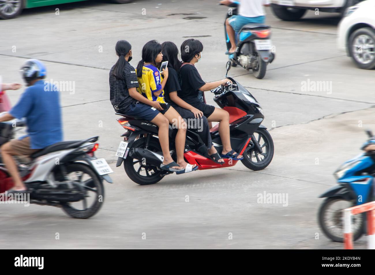Many people on one scooter hi-res stock photography and images - Alamy