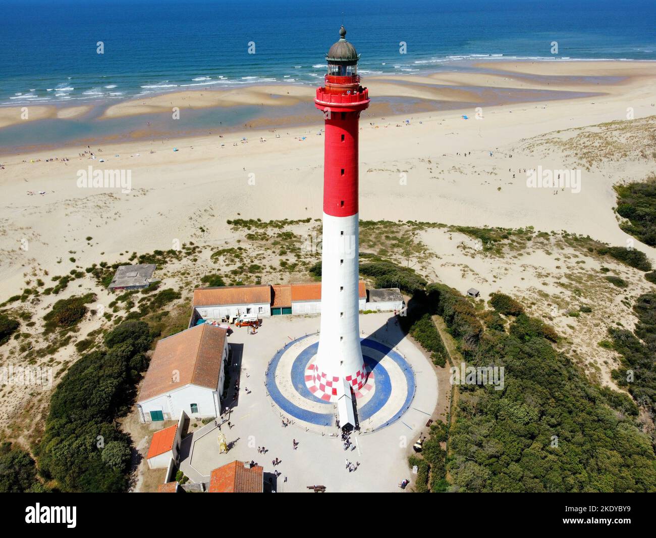 The Lighthouse of La Coubre in La Tremblade, France with a blue sea on ...