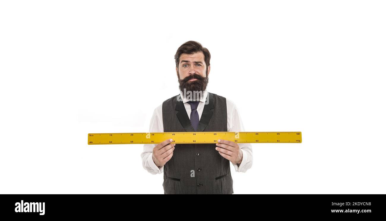 bearded man with ruler isolated on white. Measuring his height with ...