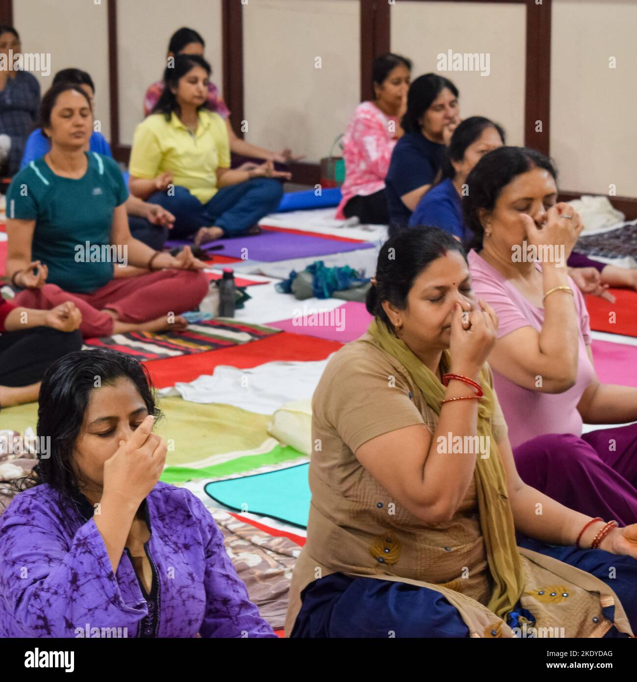 New Delhi, India, June 19 2022 -Group Yoga exercise session for people ...