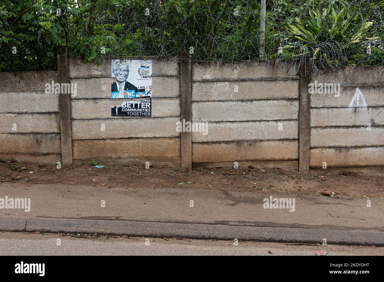 Fading ANC election posters are seen on a wall in eMbo township in ...