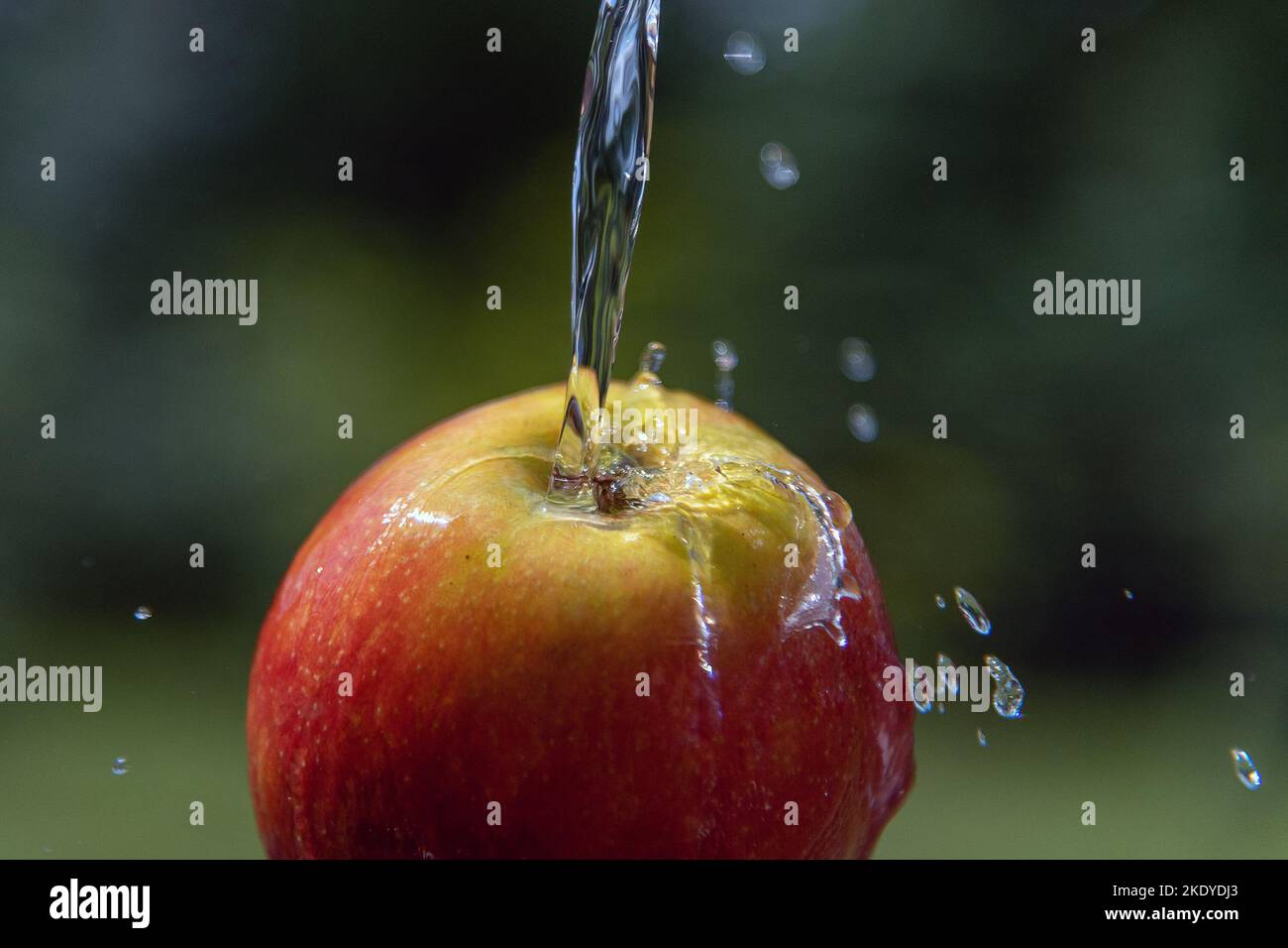 Fresh apple and pouring water Stock Photo - Alamy