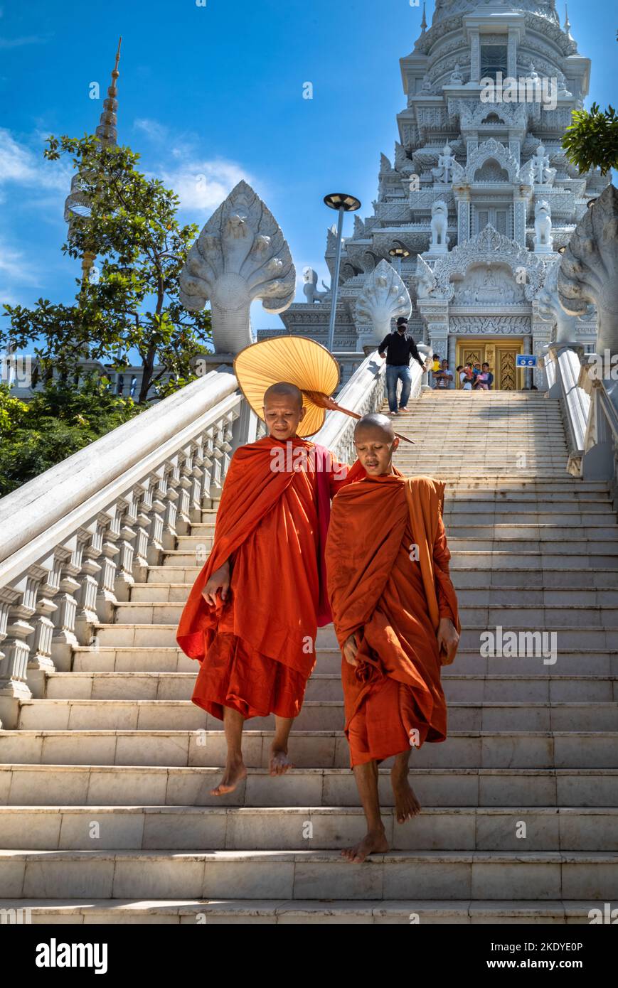 Two buddhist monks descend the stairs from Phnom Preah Reach Troap at ...