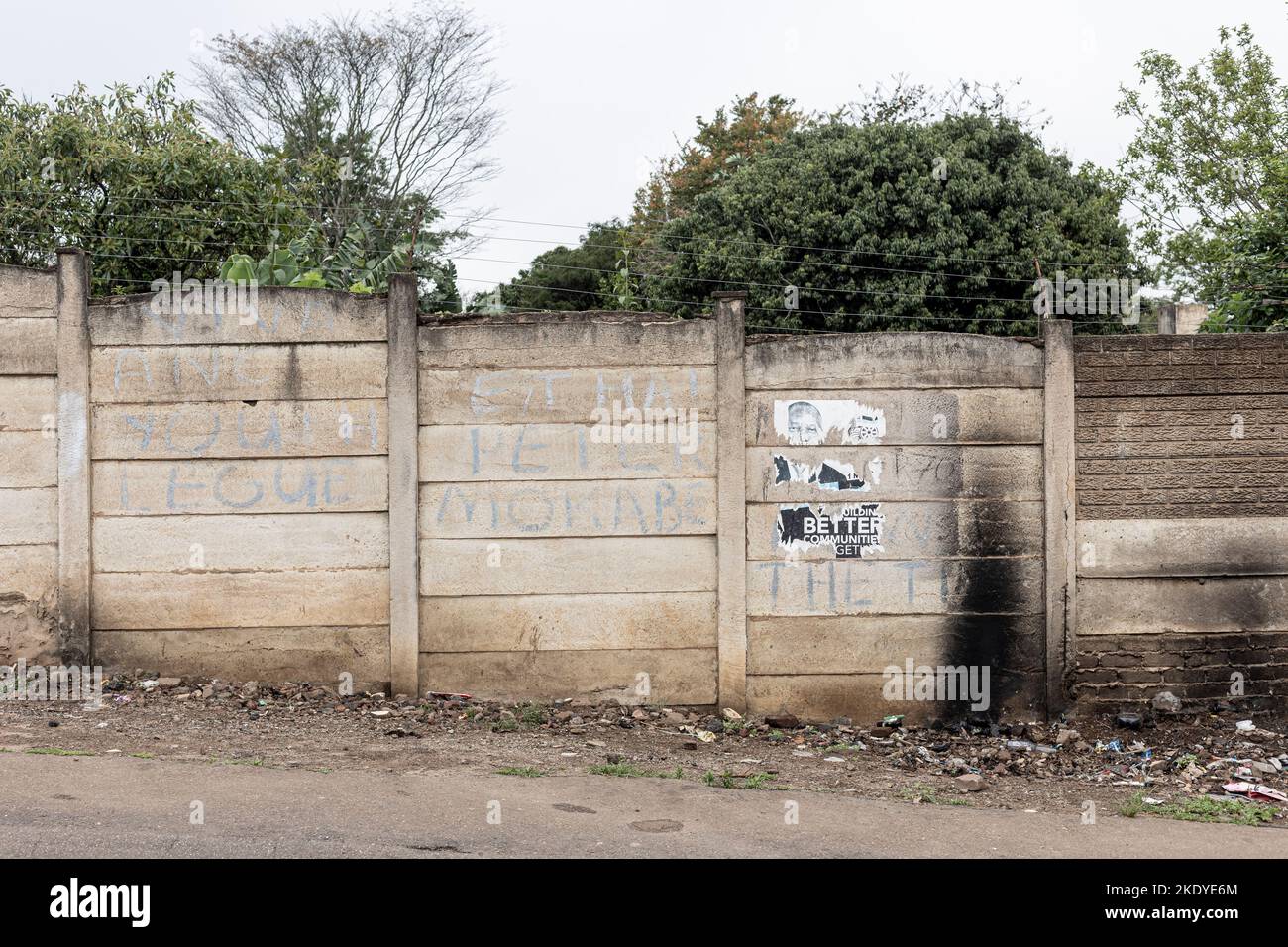 Fading ANC election posters are seen on a wall in eMbo township in ...