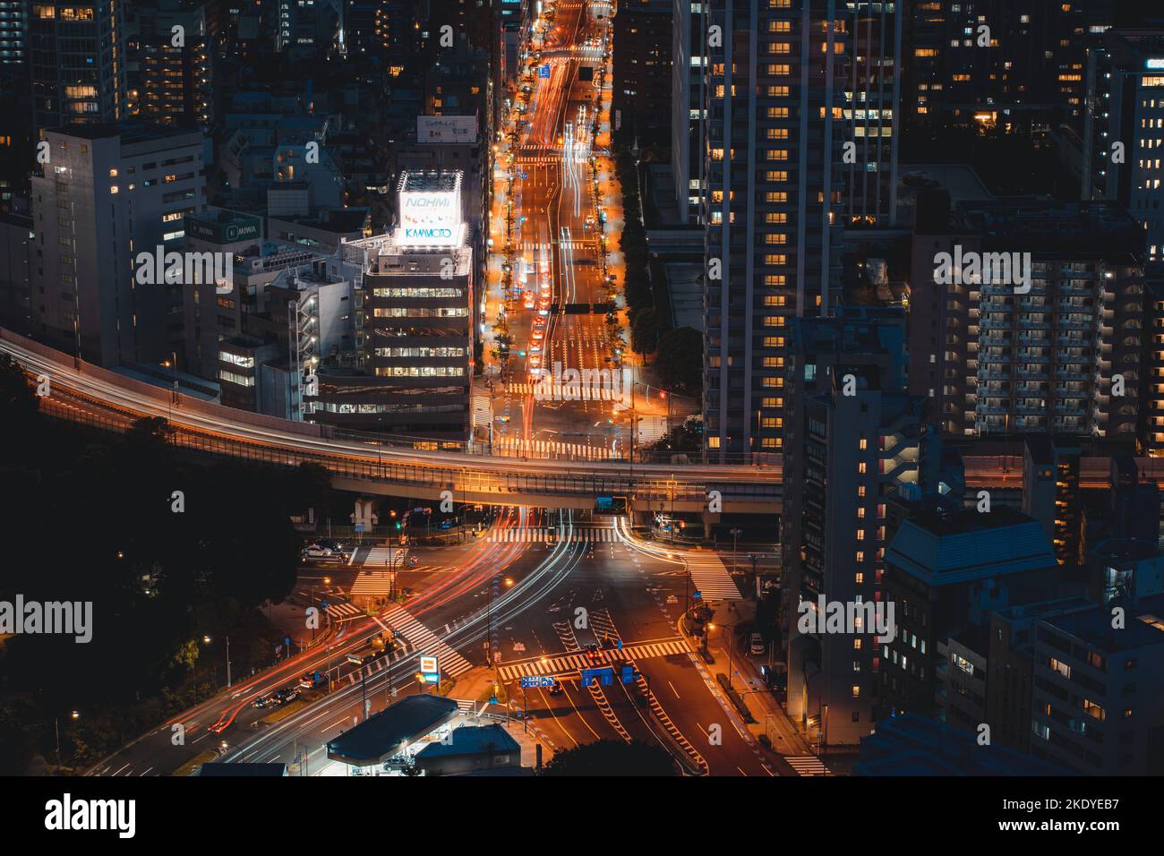 An aerial view of a long busy illuminated road in downtown Tokyo, Japan ...