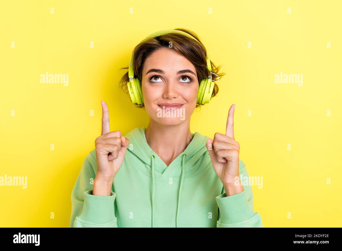 Portrait of cheerful woman with bob hairdo dressed green hoodie ...