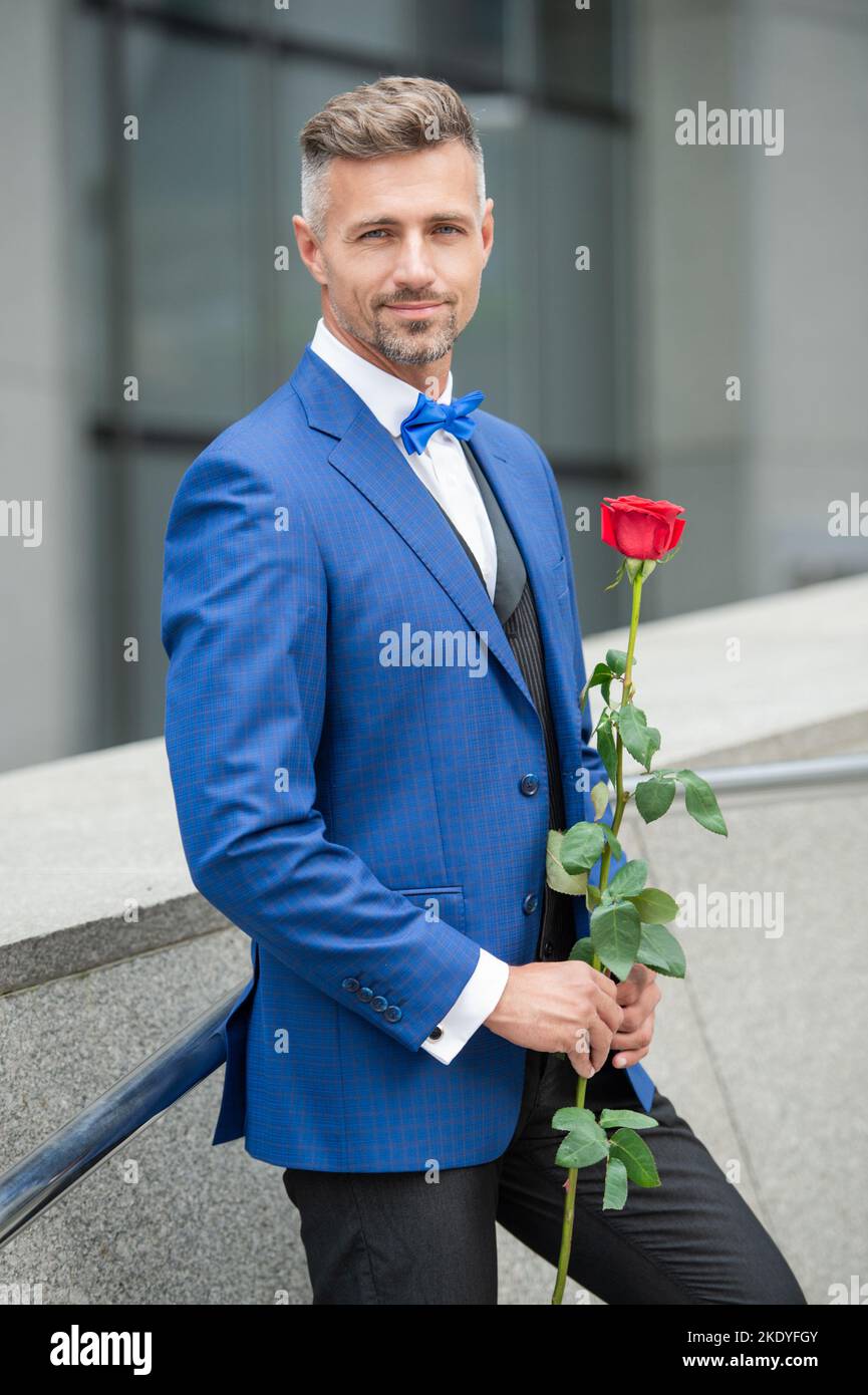 proposal concept. cheerful tuxedo man preparing for a proposal. man ...