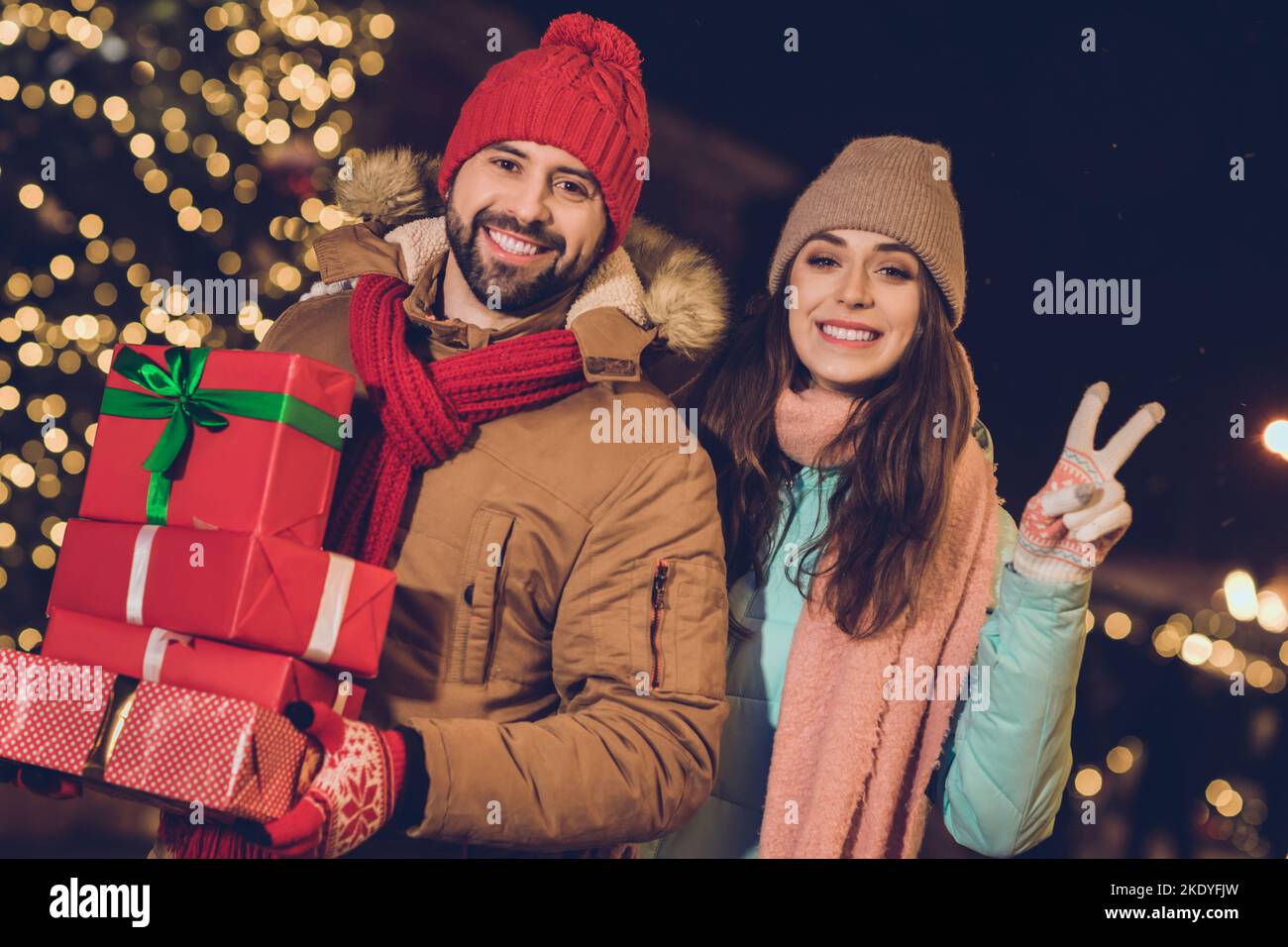 Photo of beautiful pretty wife husband walking showing v-sign buying ...