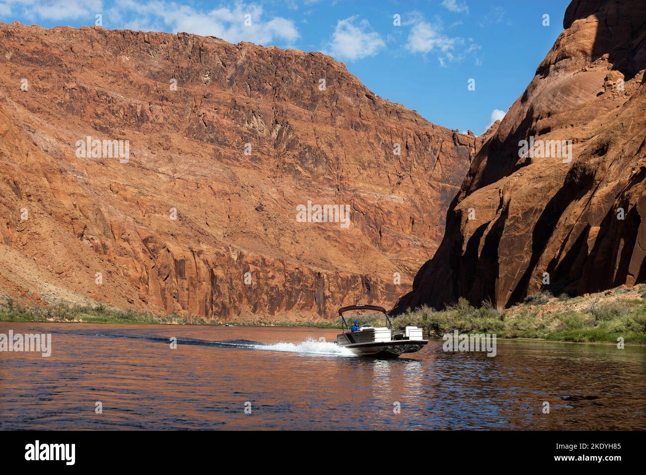 A boat pictured on the Colorado river Majestic Horseshoe Bend, Arizona ...