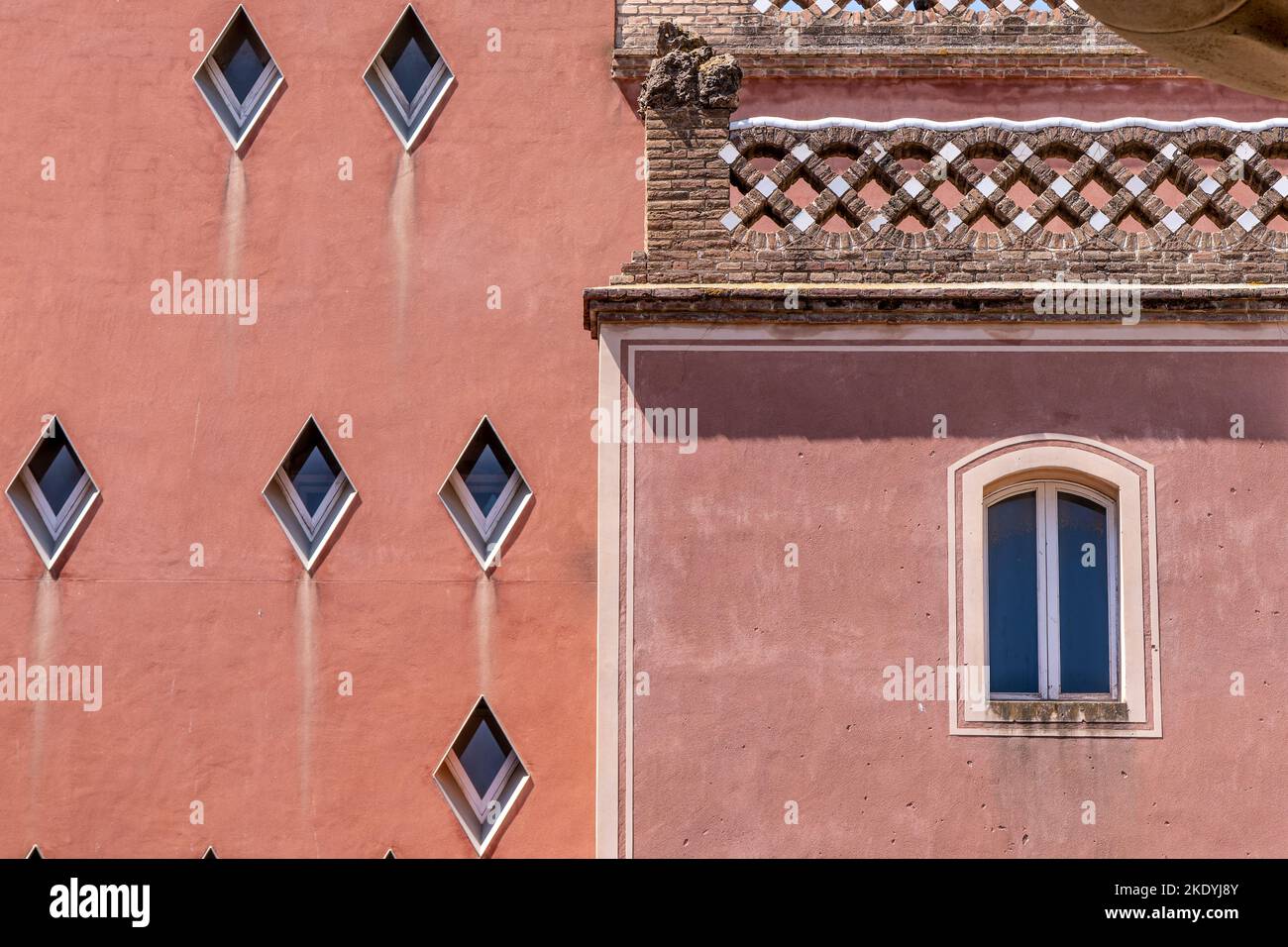 A vertical shot of the wall of the building with strange windows Stock ...