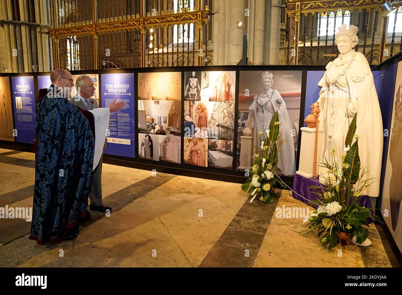 King Charles III is shown a scaled replica of the statue of Queen ...