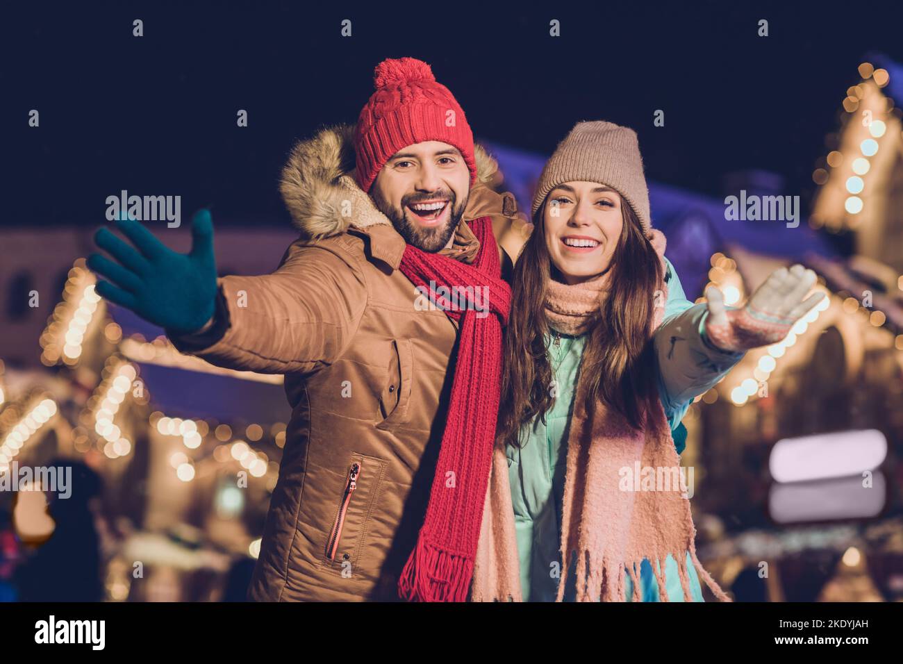 Photo of funky brunette student family hug camera wear hat jacket scarf ...