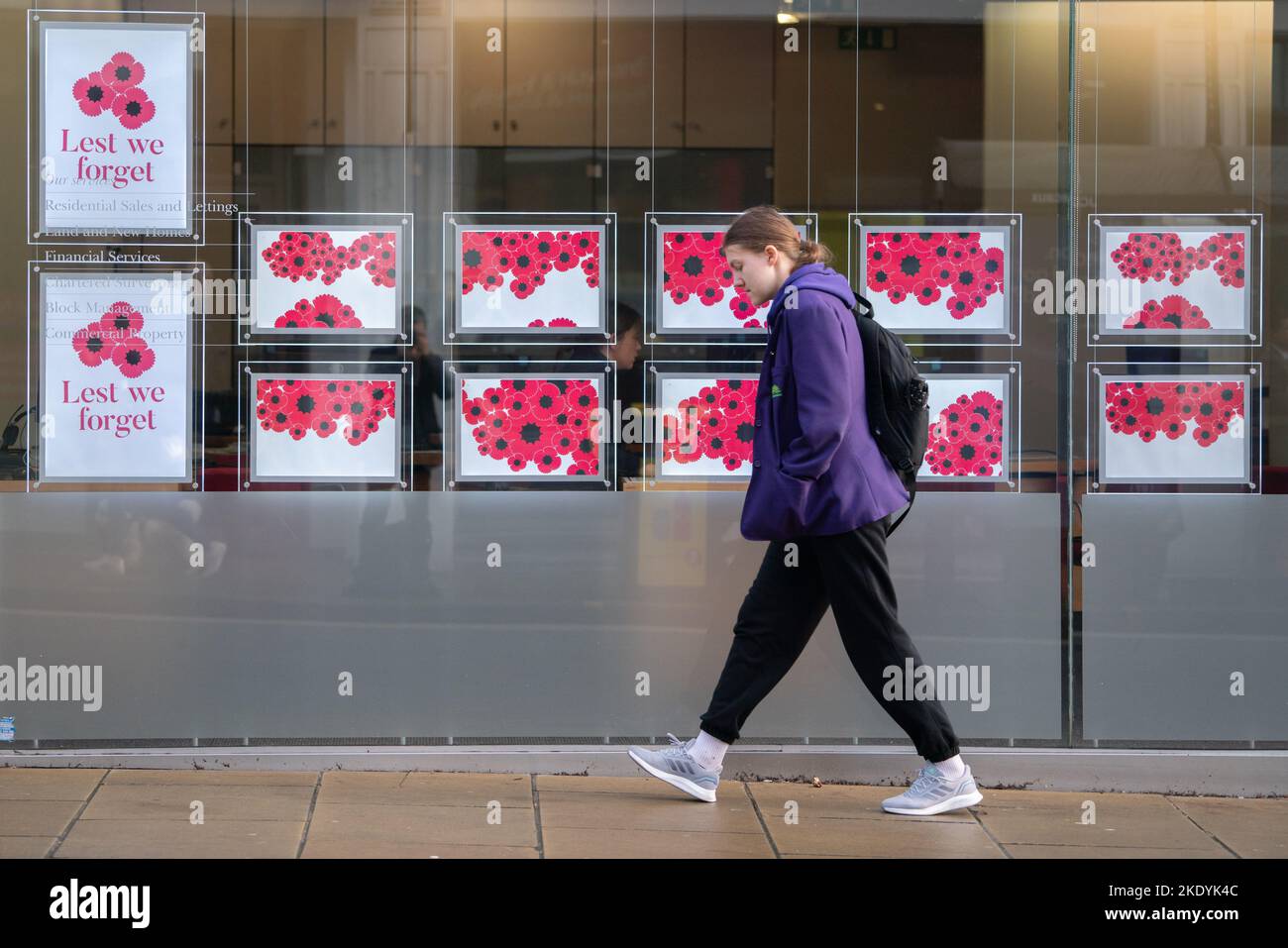 London UK. 9 November 2022. Pedestrians walk past a window of an estate ...
