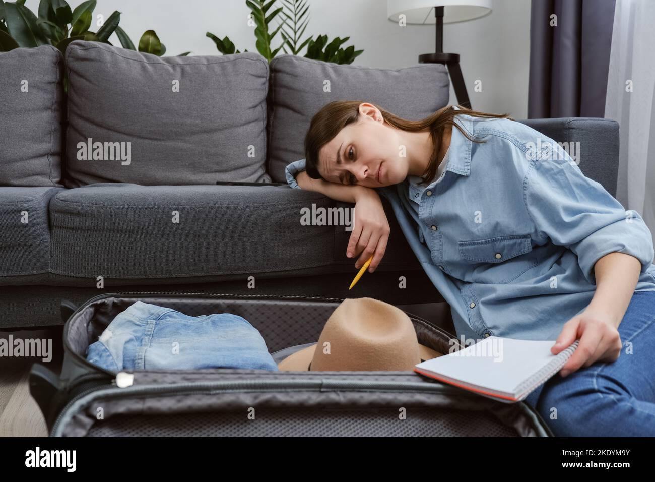 Unhappy sad brunette girl forget things from her list before long ...