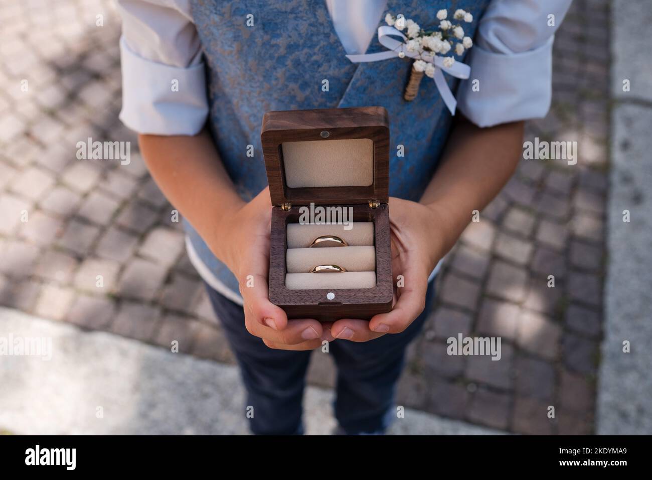 Boy holding the rings hi-res stock photography and images - Alamy