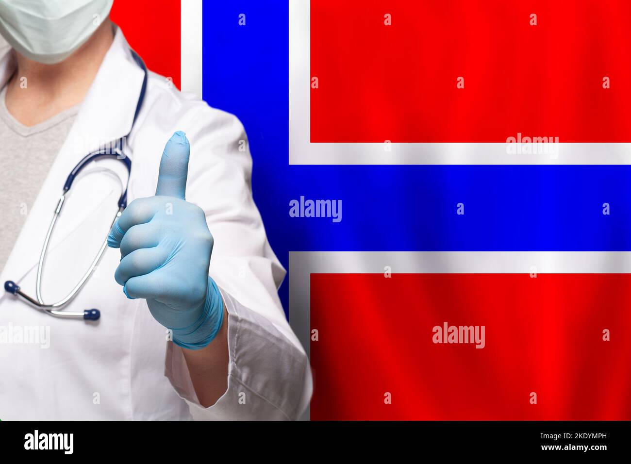 Norwegian doctor's hand showing thumb up positive gesture on flag of ...