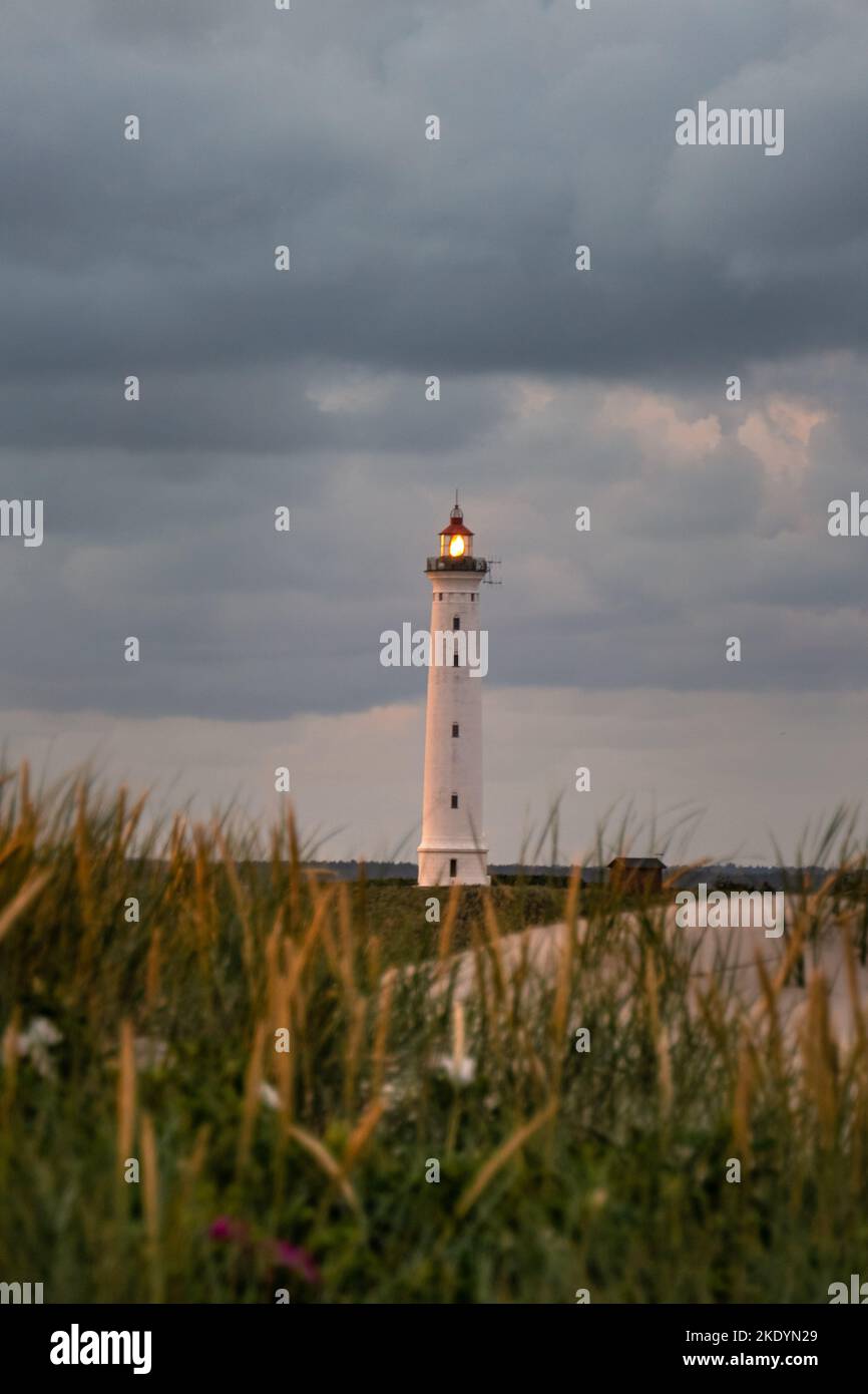 A vertical shot of a lighthouse on a cloudy day Stock Photo - Alamy