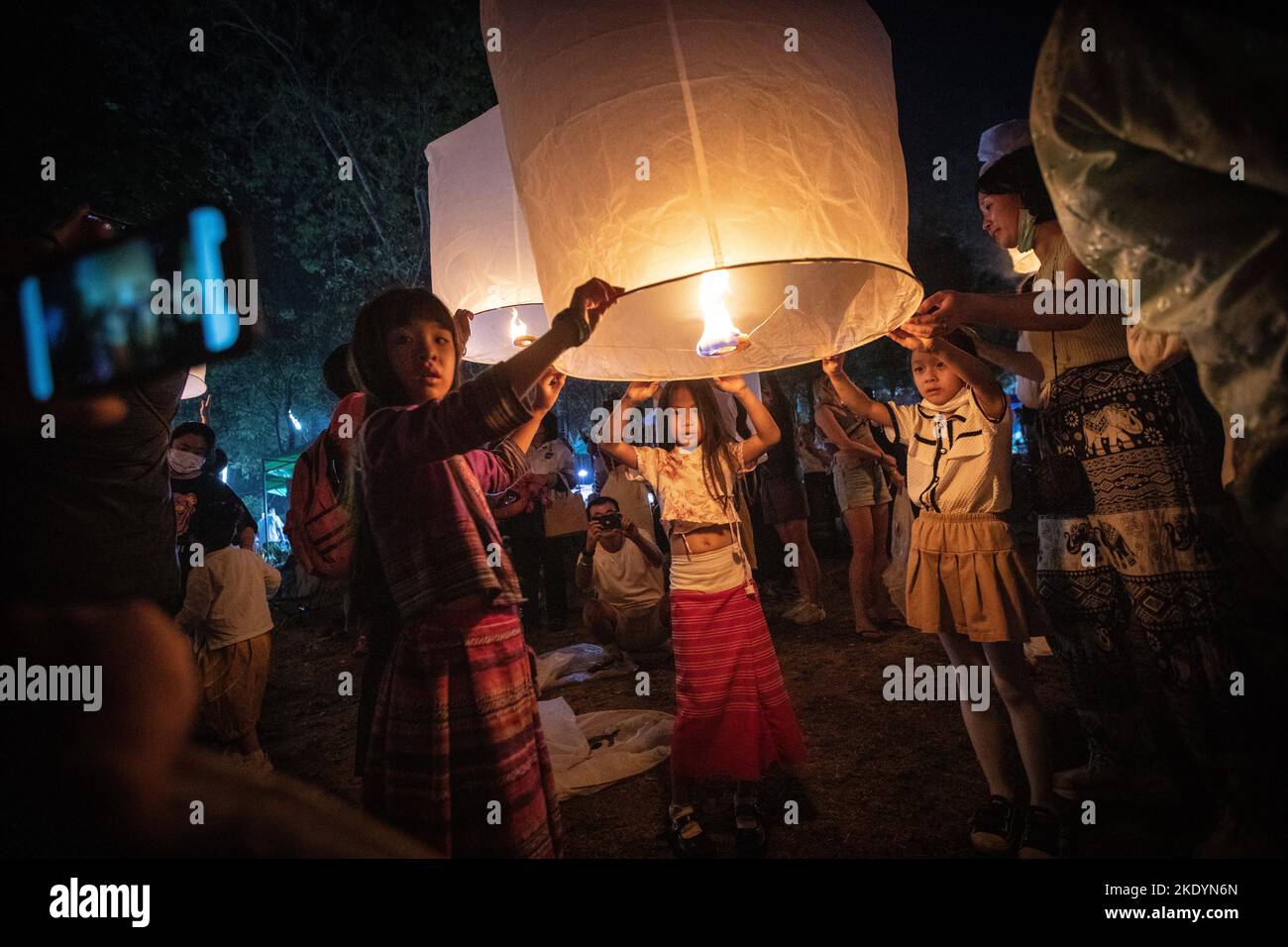 Young girls hold a lantern during Yi Peng (Yee Peng) Festival & Loy ...