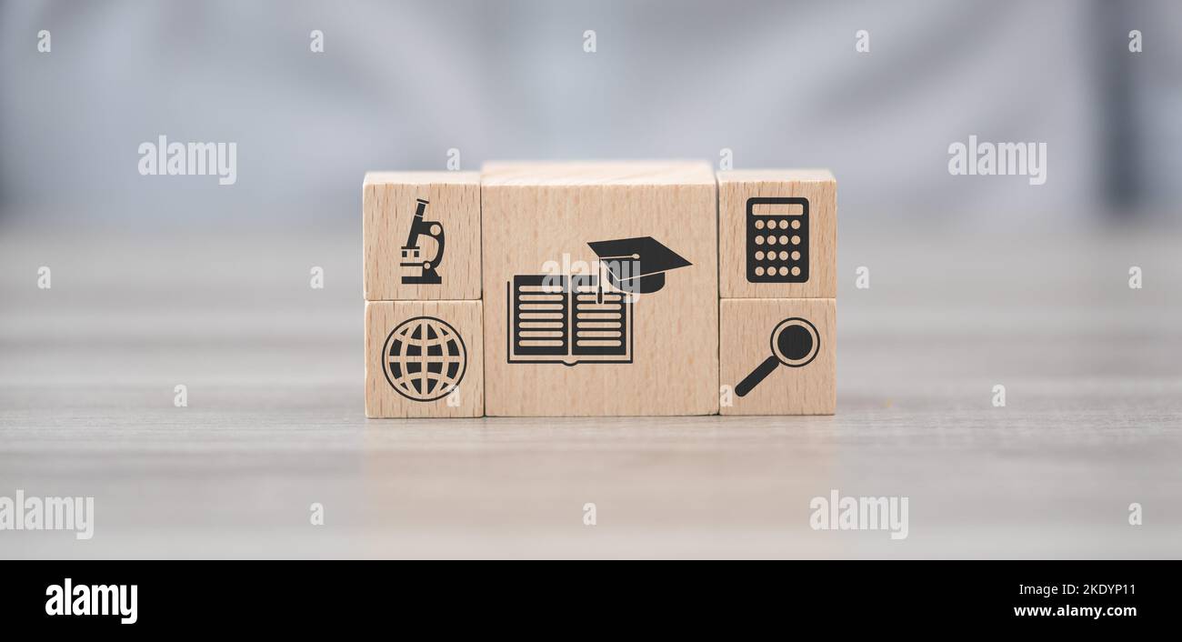 Wooden blocks with symbol of education concept Stock Photo - Alamy