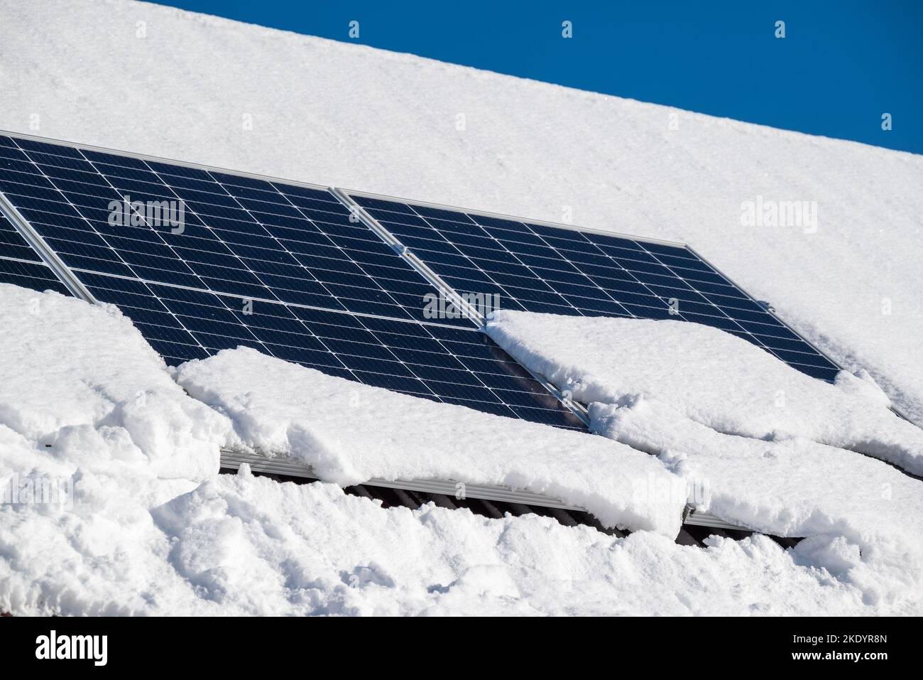 Solar panels under snow in winter Stock Photo - Alamy