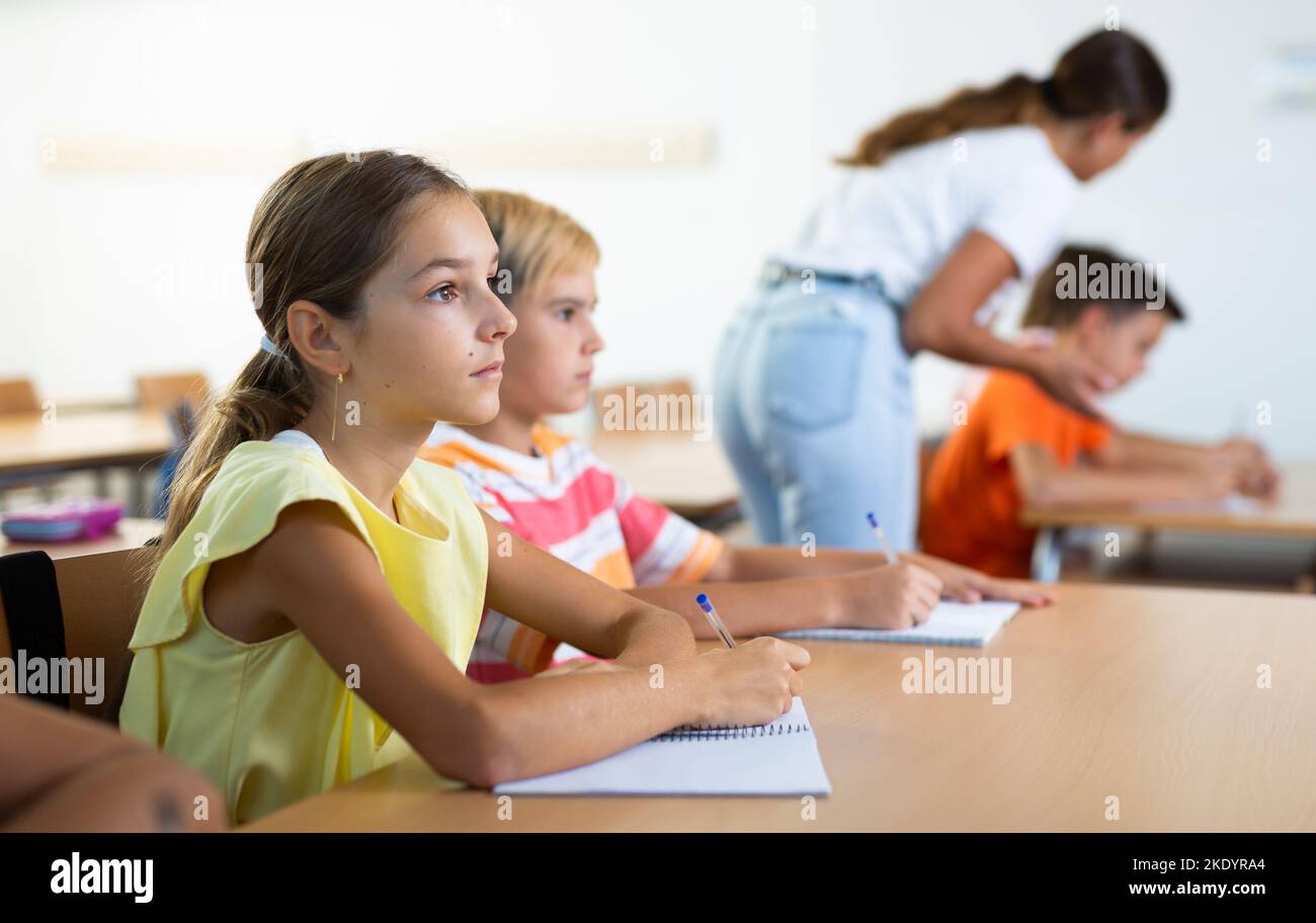 Boy and girl studying in classroom Stock Photo - Alamy