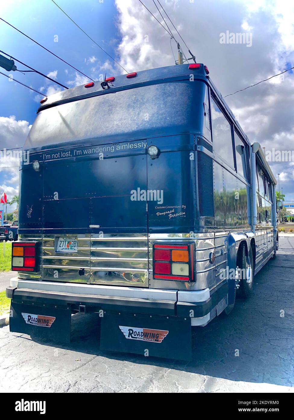 A vertical shot of the back of the 1989 MCI bus on a sunny day with the ...