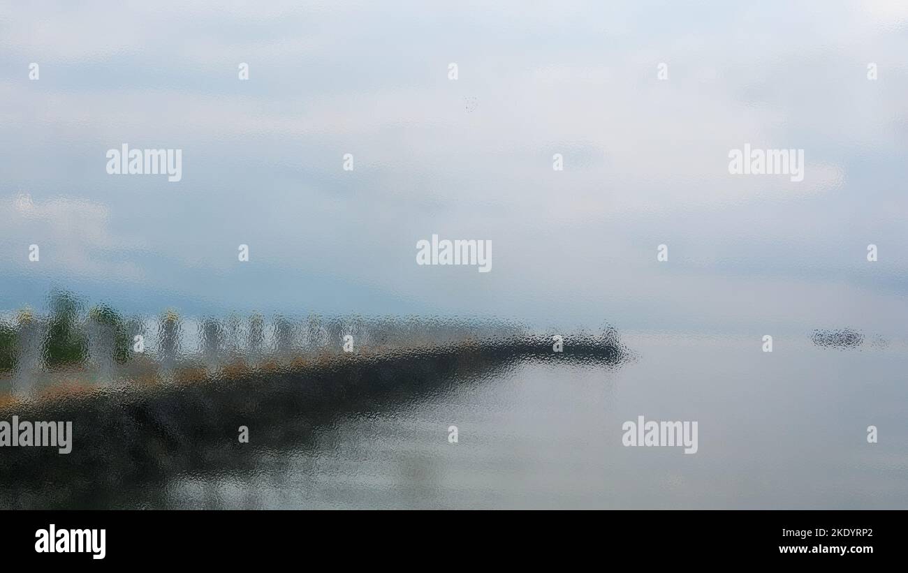 Blurry an amazing pier on the beautiful Manado beach Stock Photo - Alamy