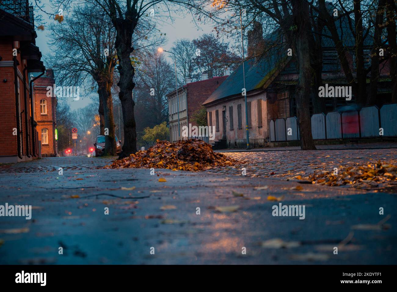 Liepaja city street in rainy autumn evening Stock Photo - Alamy