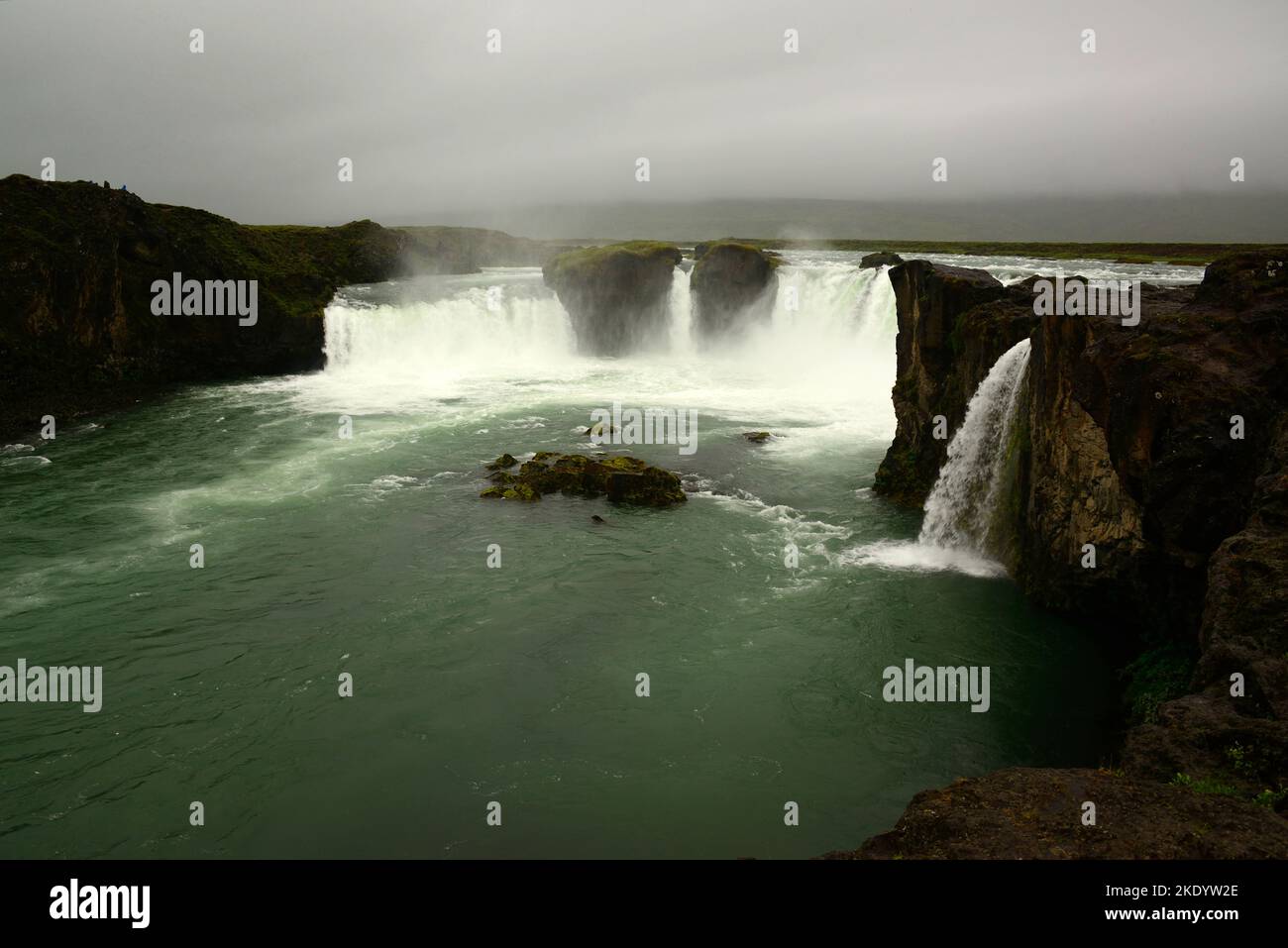 A scenic shot of Godafoss Waterfall in Iceland on a cloudy gloomy sky ...