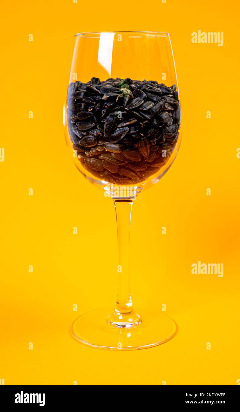 white sunflower seeds in glass jar. in bucket sunflower seeds on black ...