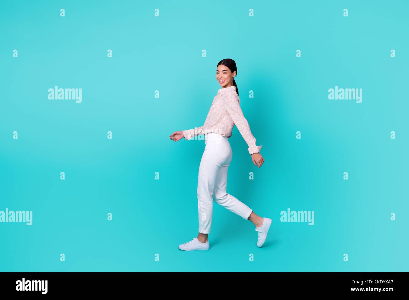 Full length profile photo of cute young korean lady go shopping smiling ...