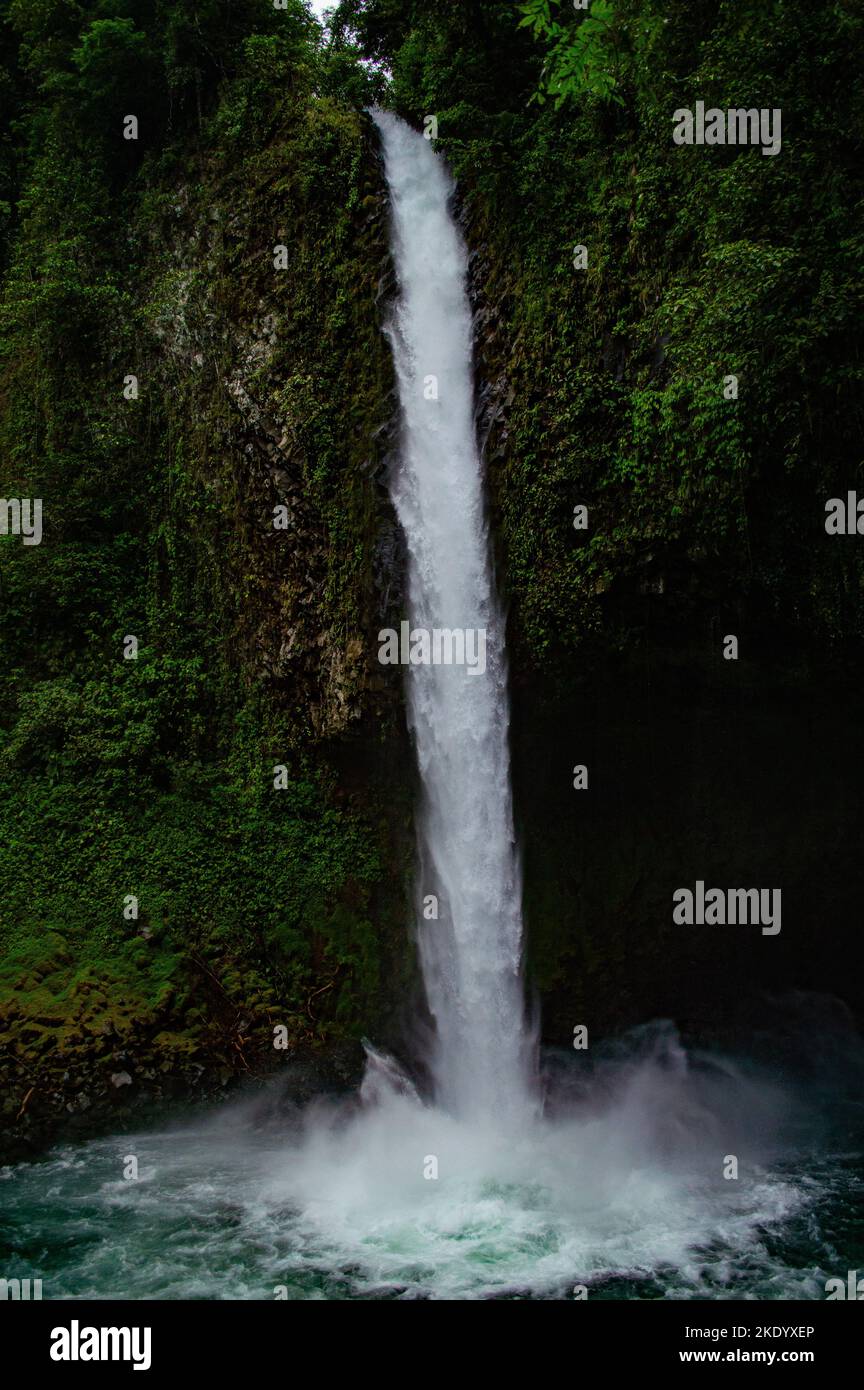 A vertical shot of a Waterfall in Arenal, Costa Rica Stock Photo - Alamy