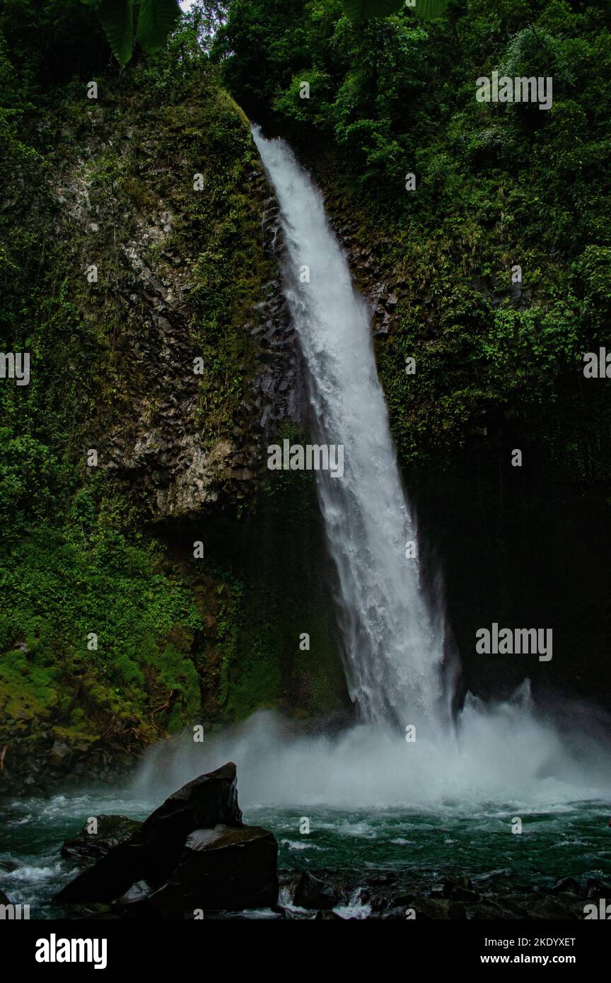 A vertical shot of a waterfall in Arenal, Costa Rica Stock Photo - Alamy