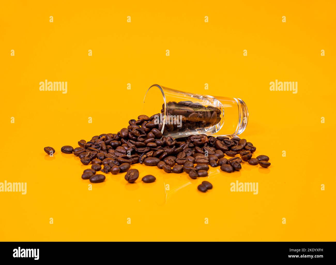 Dropped Many roasted coffee beans in a glass, in bucket jar. self ...