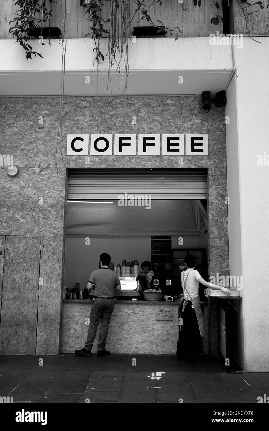 An interior grayscale shot of simple retail coffee shop in Sydney Stock ...
