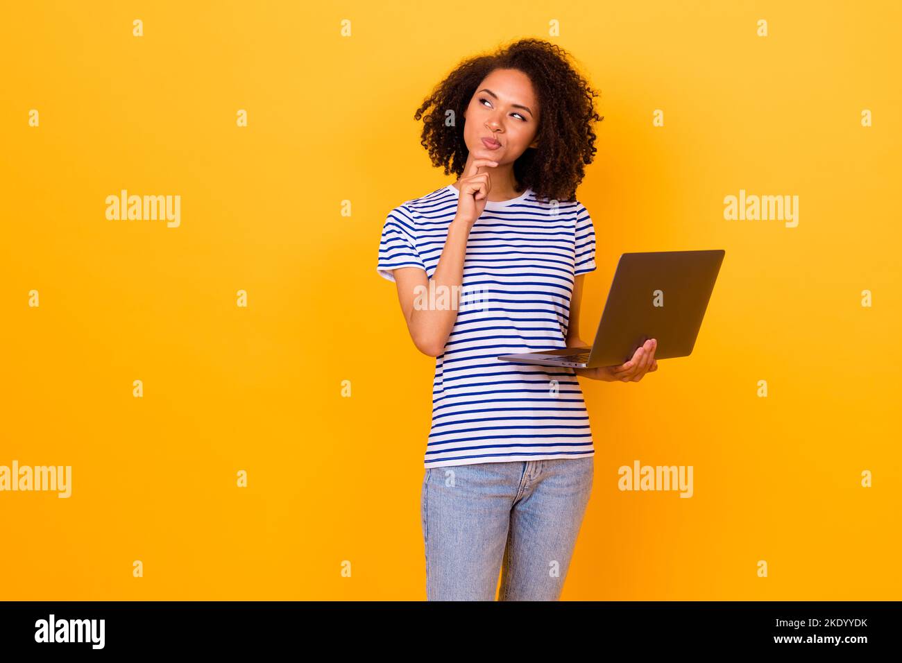 Photo of pretty minded girl hand touch chin look empty space hold ...