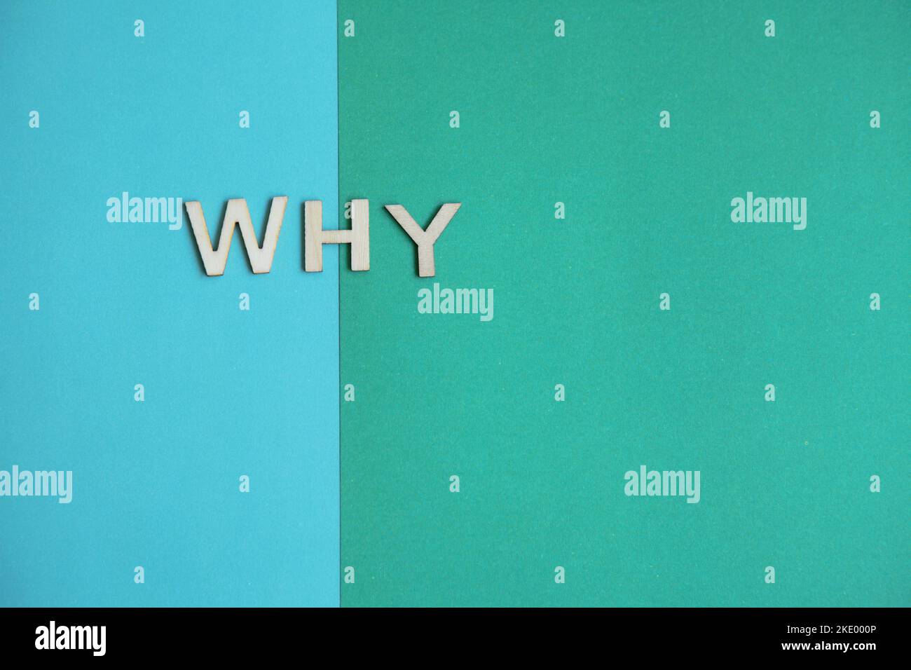 The letters WHY spelled on a green blue background Stock Photo - Alamy