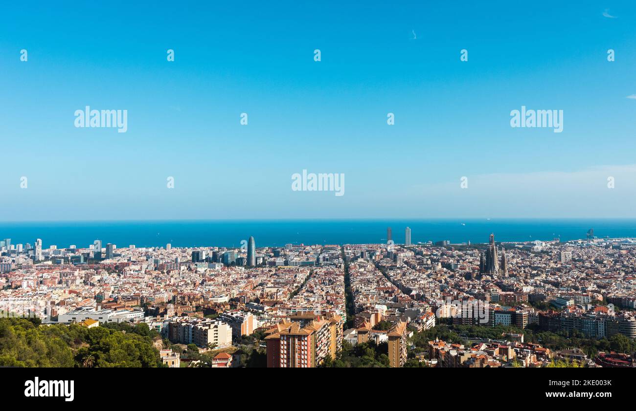 An aerial drone shot of the cityscape during the daytime in Barcelona ...