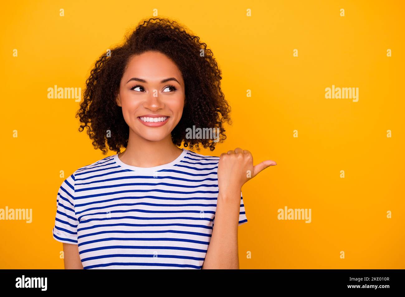 Photo of charming dreamy lady wear white t-shirt looking showing thumb ...