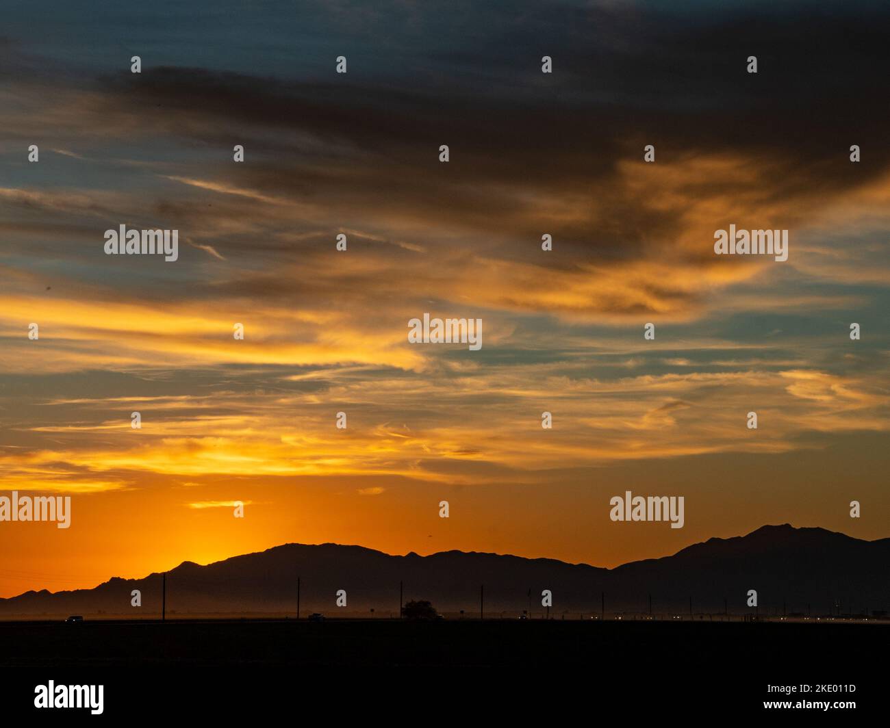A stunning Arizona sunset on a cool, crisp and clear fall evening glows ...