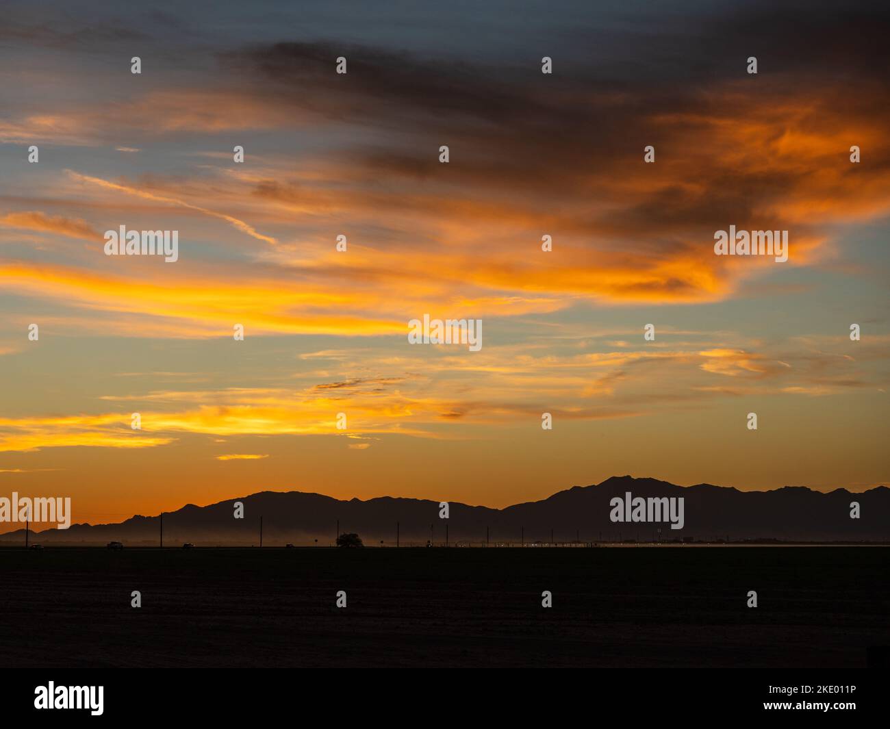 A stunning Arizona sunset on a cool, crisp and clear fall evening glows ...