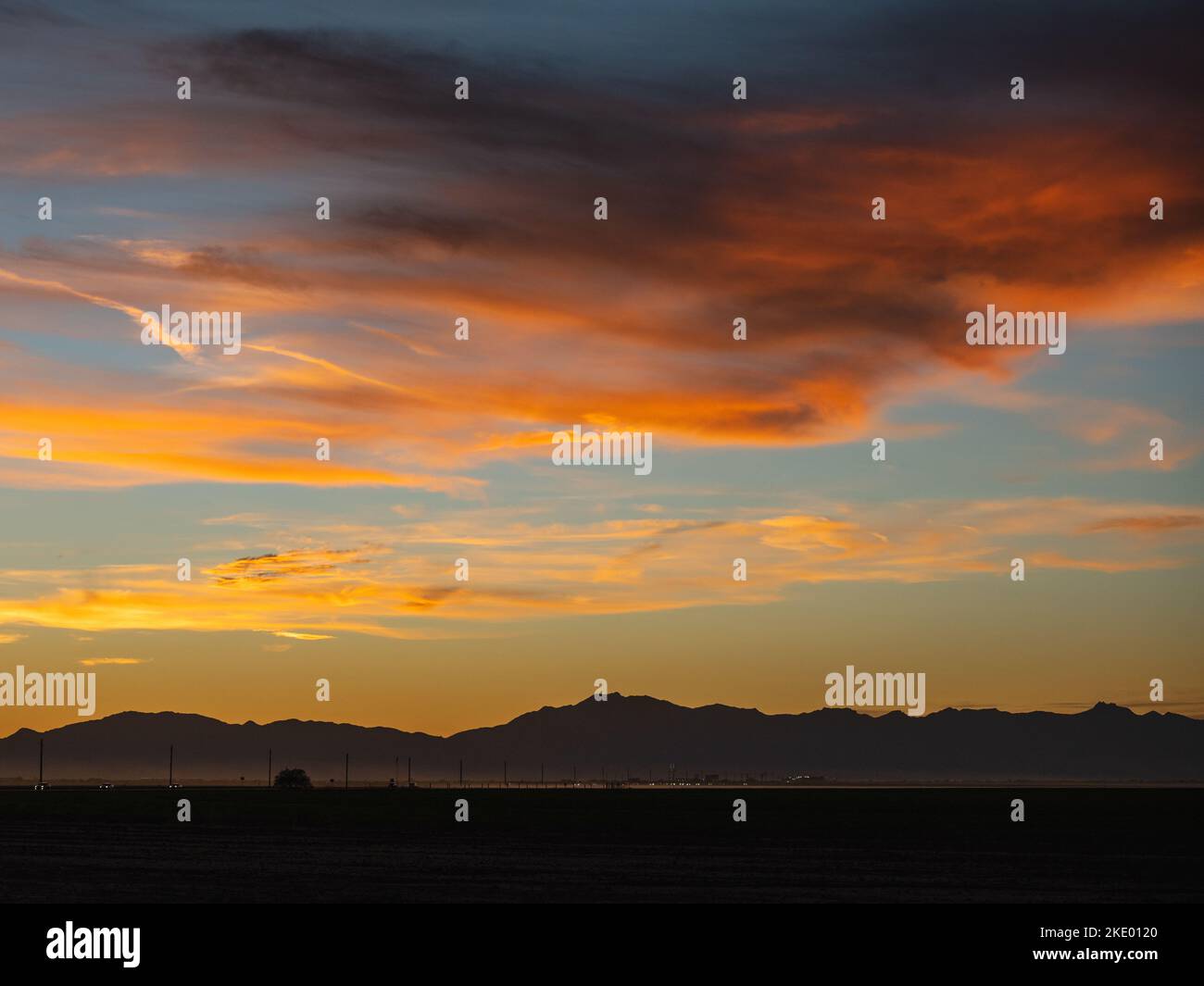 A stunning Arizona sunset on a cool, crisp and clear fall evening glows ...