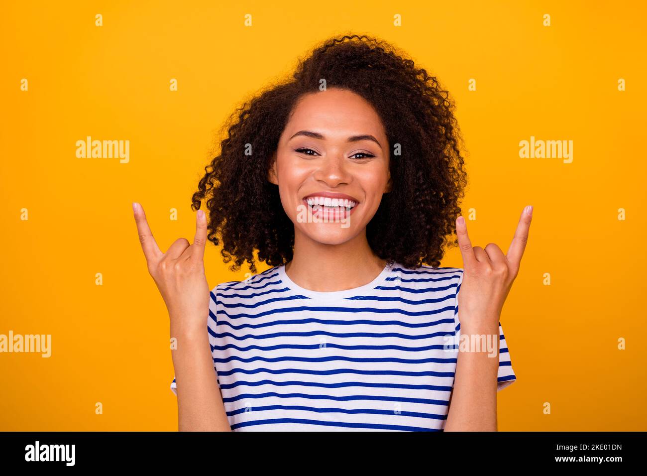 Photo of careless excited girl hands fingers show heavy metal symbol ...