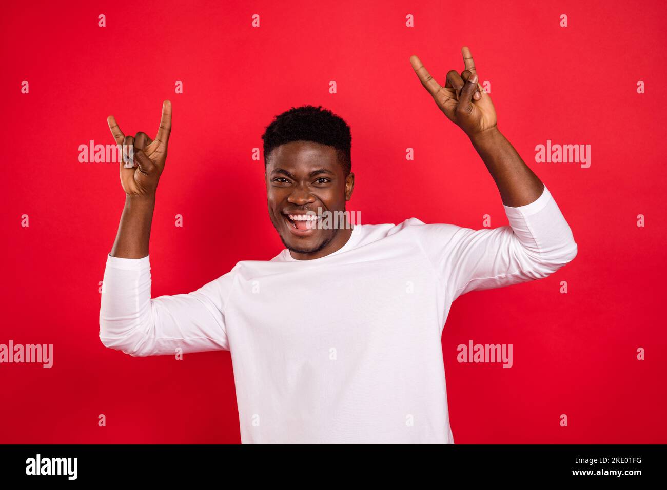 Portrait of childish positive person two arms fingers show heavy metal ...
