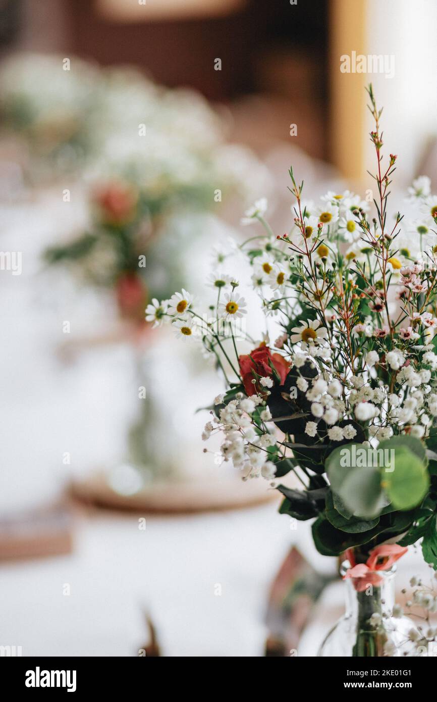 A vertical shot of a beautiful small bouquet on a wedding table Stock ...