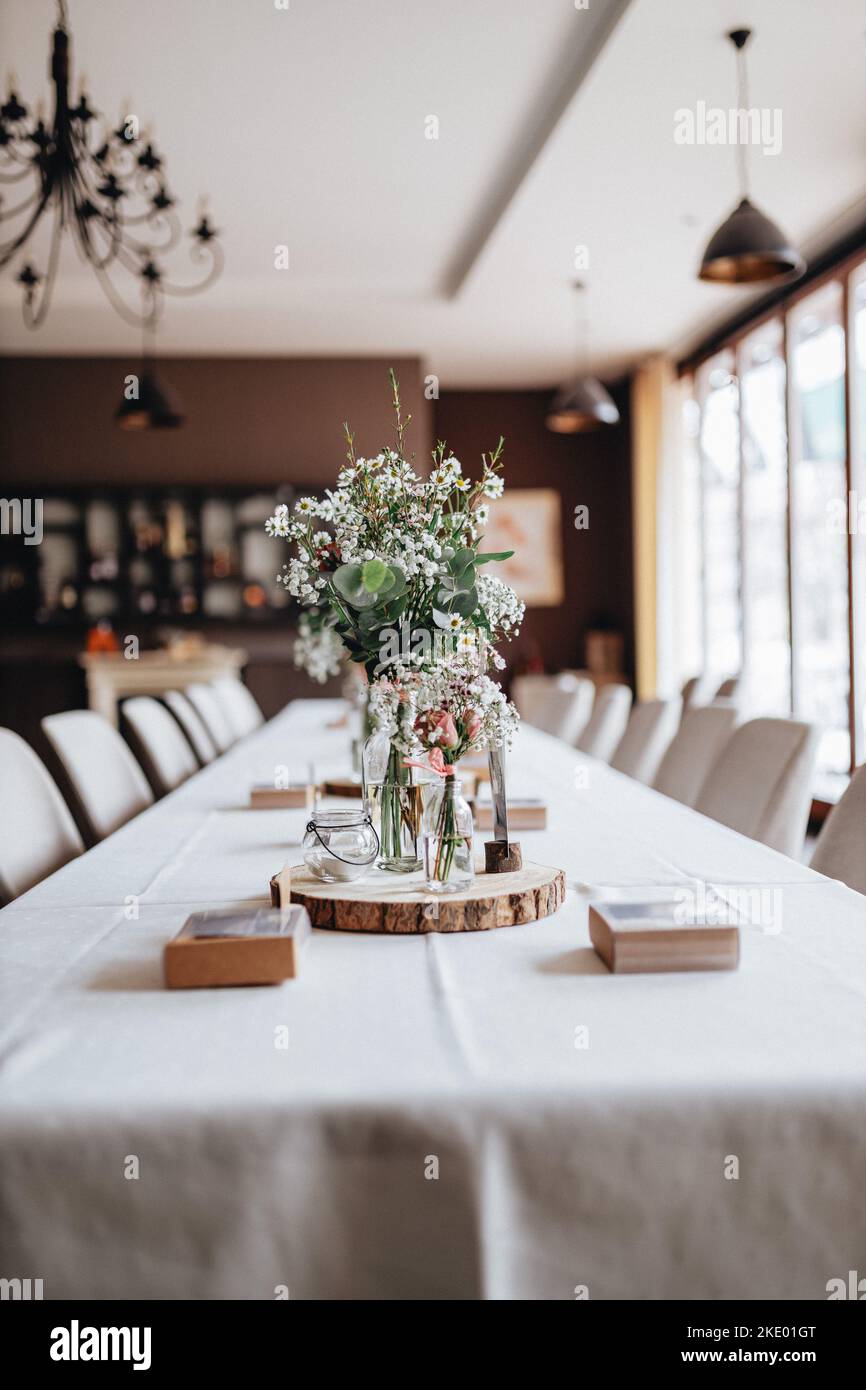A vertical shot of a beautiful small bouquet on a wedding table Stock ...