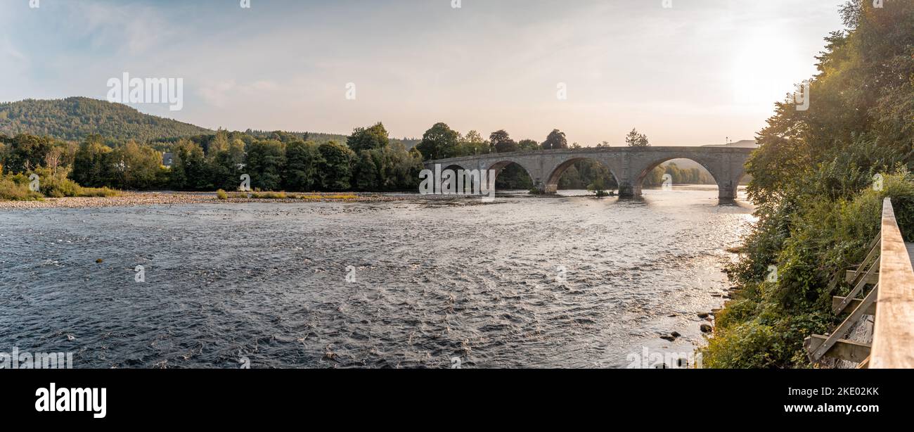 The majestic Dunkeld bridge at the river Tay surrounded by greenery ...