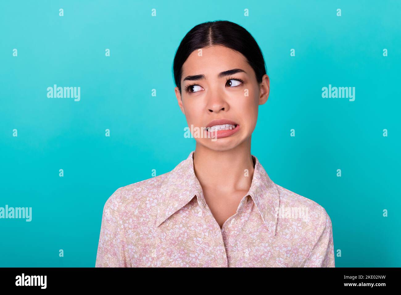 Photo of unsatisfied malaysian girl grin teeth look curious empty space ...