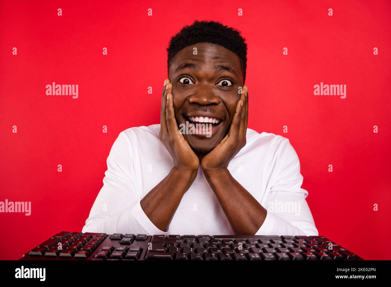 Photo of excited impressed guy dressed white shirt writing modern ...