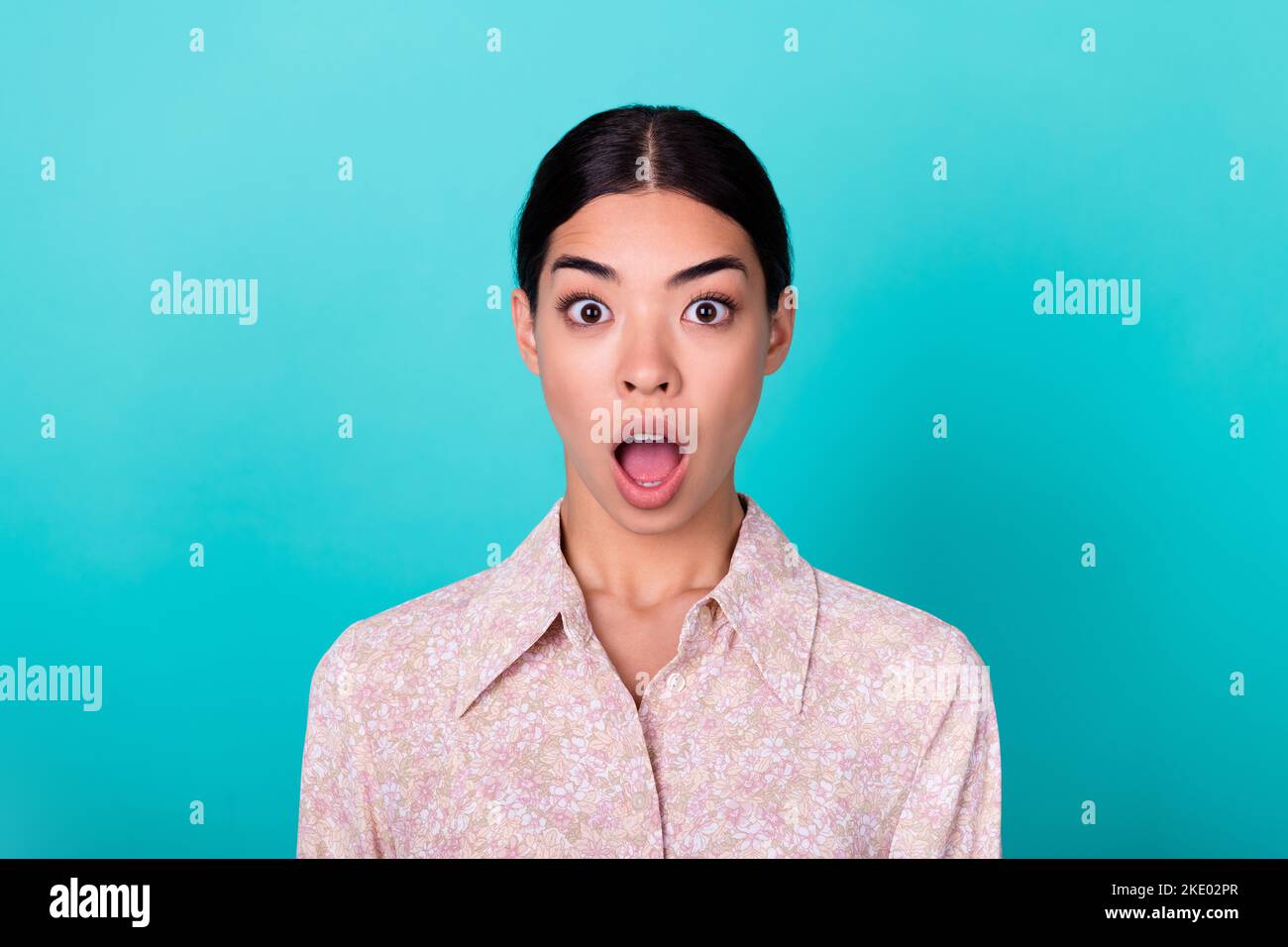 Portrait Of Impressed Filipino Person Open Mouth Speechless Isolated On Bright Cyan Color